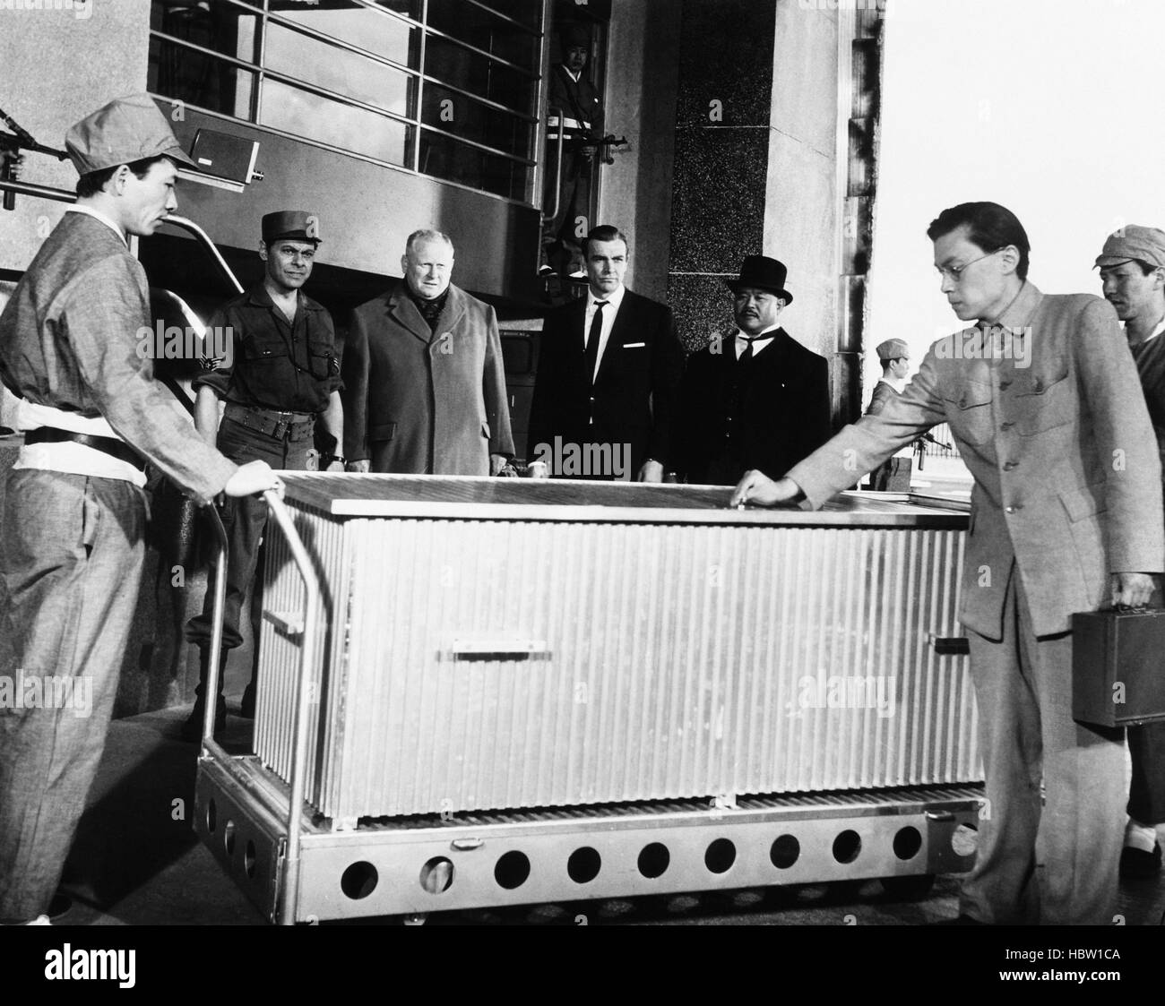 GOLDFINGER, rear from second left: Gert Frobe, Sean Connery, Harold ...