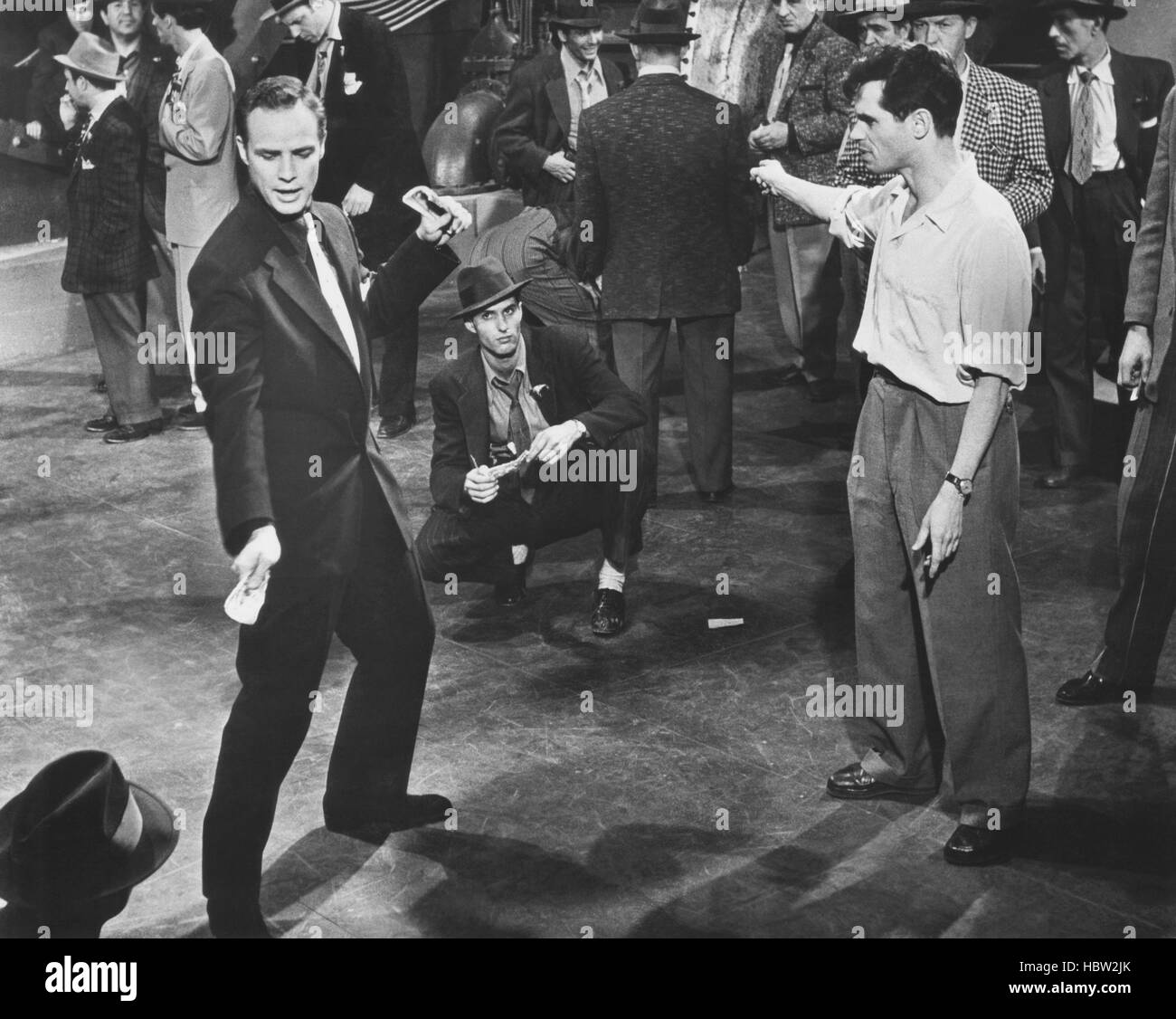 GUYS AND DOLLS, from left: Marlon Brando, choreographer Michael Kidd on ...