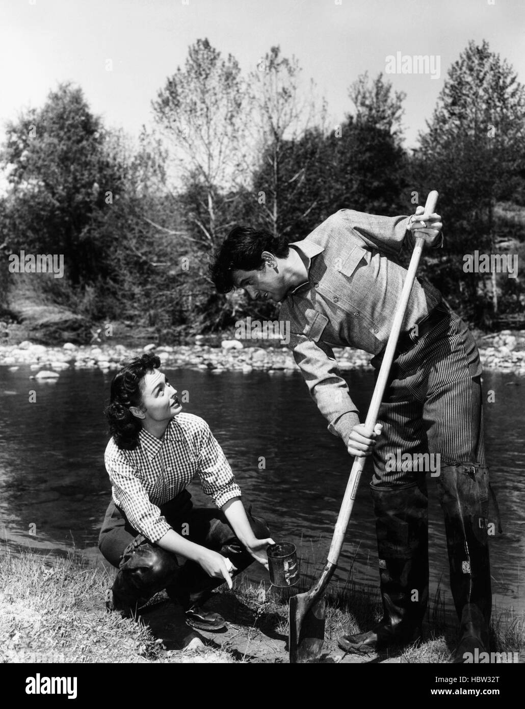 GUN FURY, from left, Donna Reed, Rock Hudson, taking a break to go ...