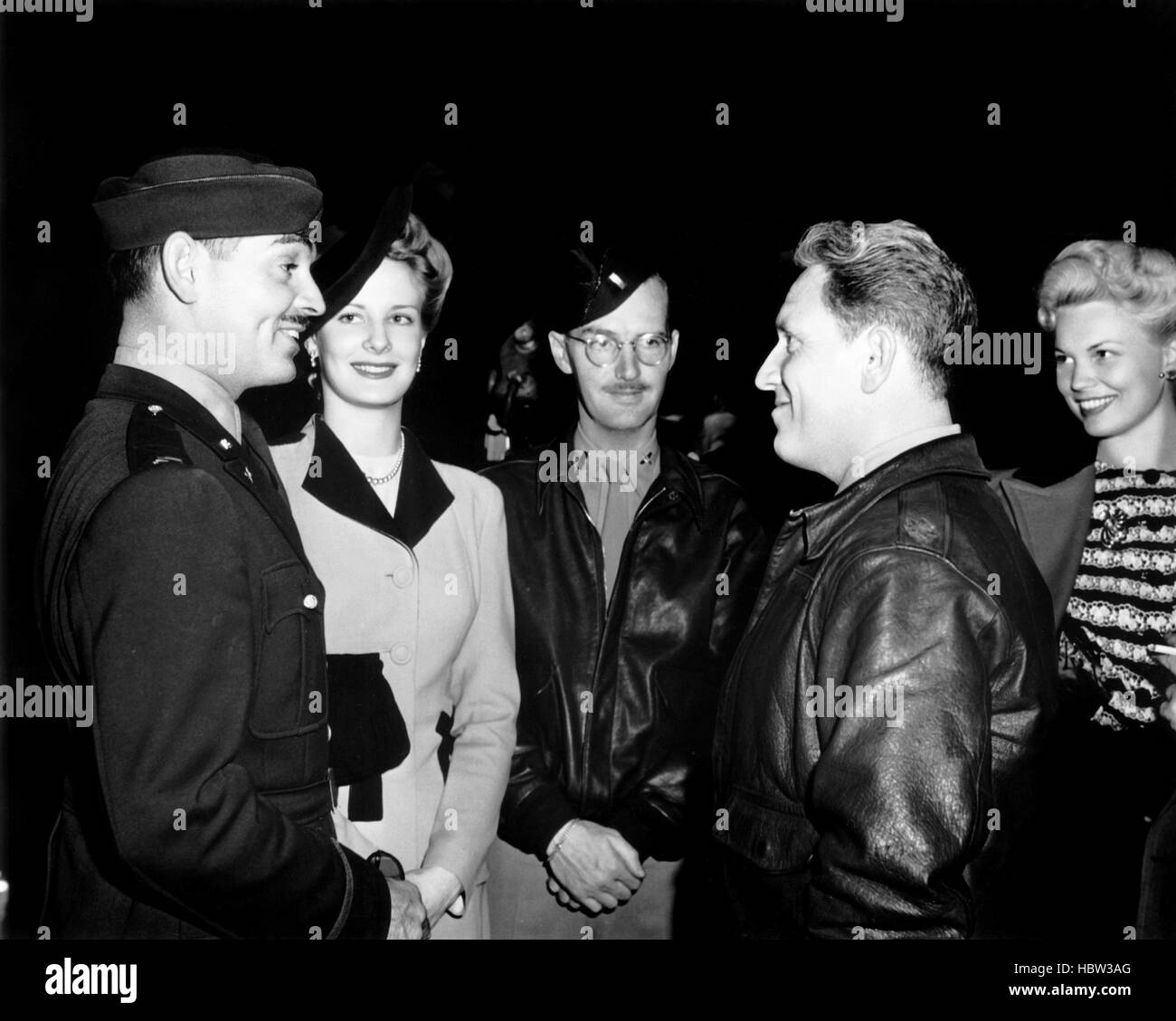 A GUY NAMED JOE, Clark Gable, left, visits pal Spencer Tracy on-set, as ...