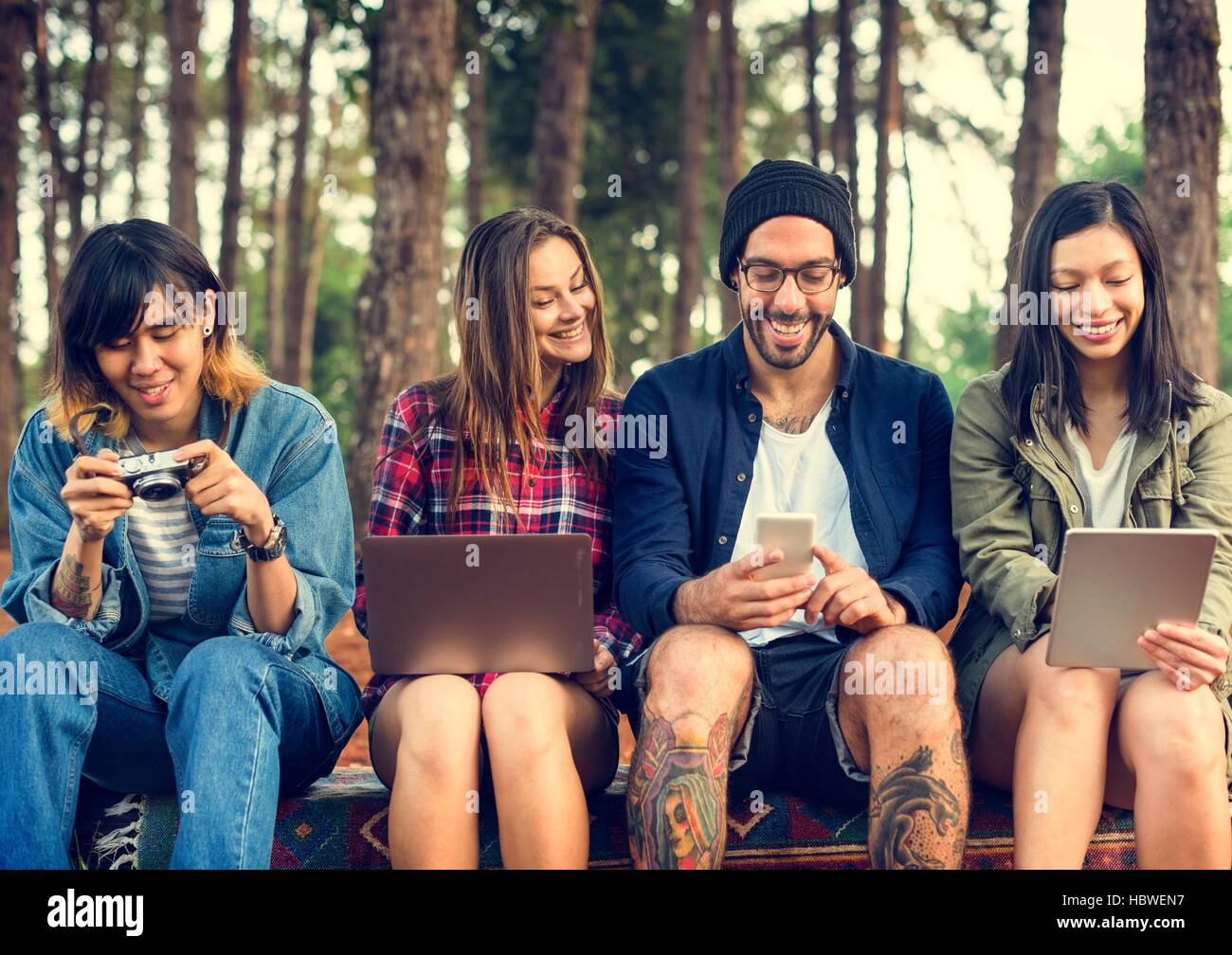 Friends Using Digital Device Outdoors Concept Stock Photo - Alamy
