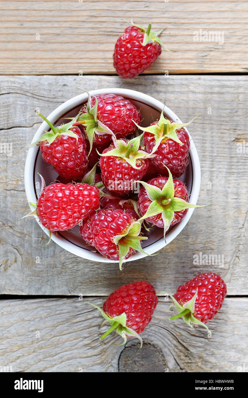 Raspberry in bowl top view Stock Photo - Alamy