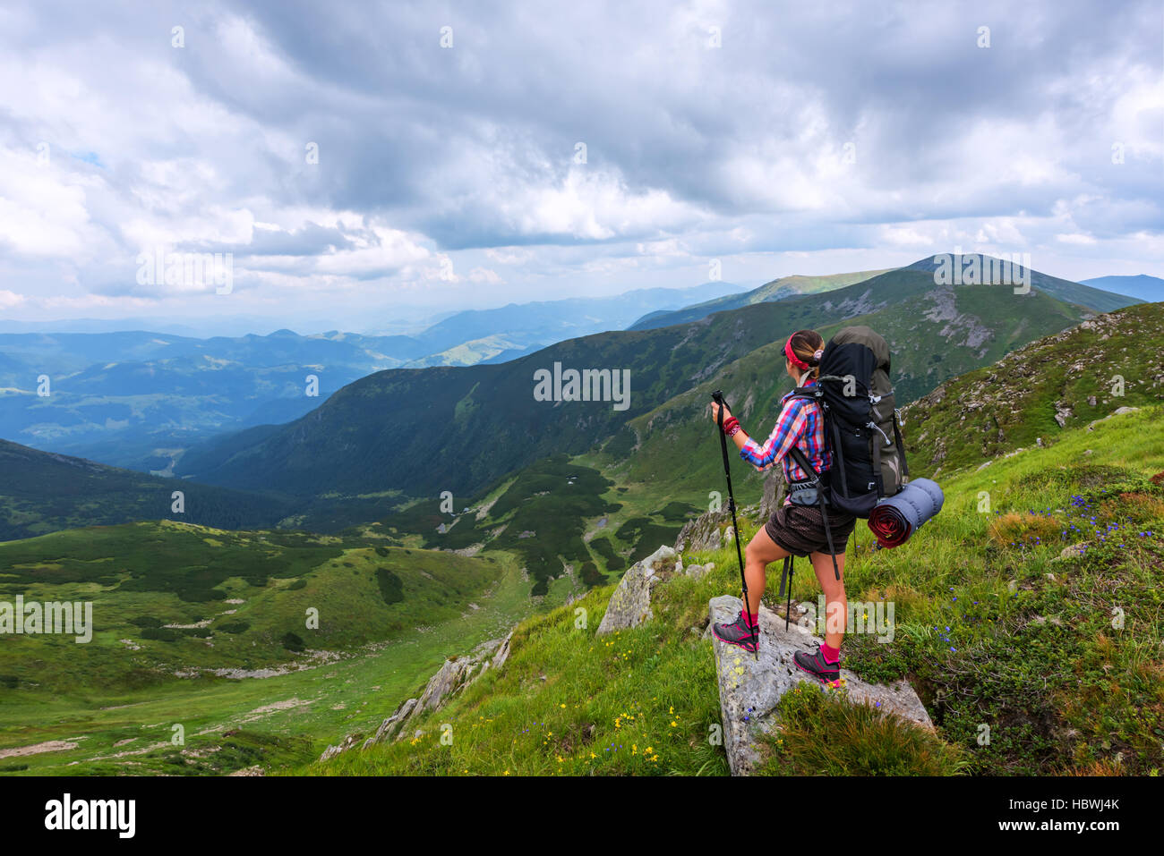 alone tourist in high mountain Stock Photo - Alamy
