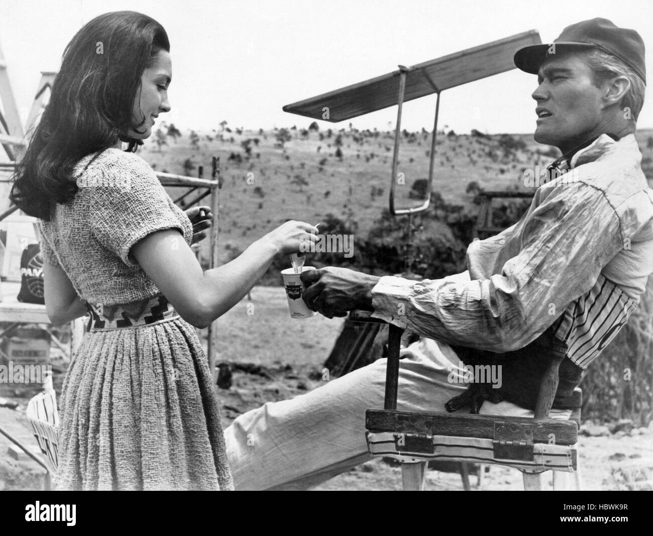 GERONIMO, from left; Kamala Devi, Chuck Connors, between scenes, on set ...