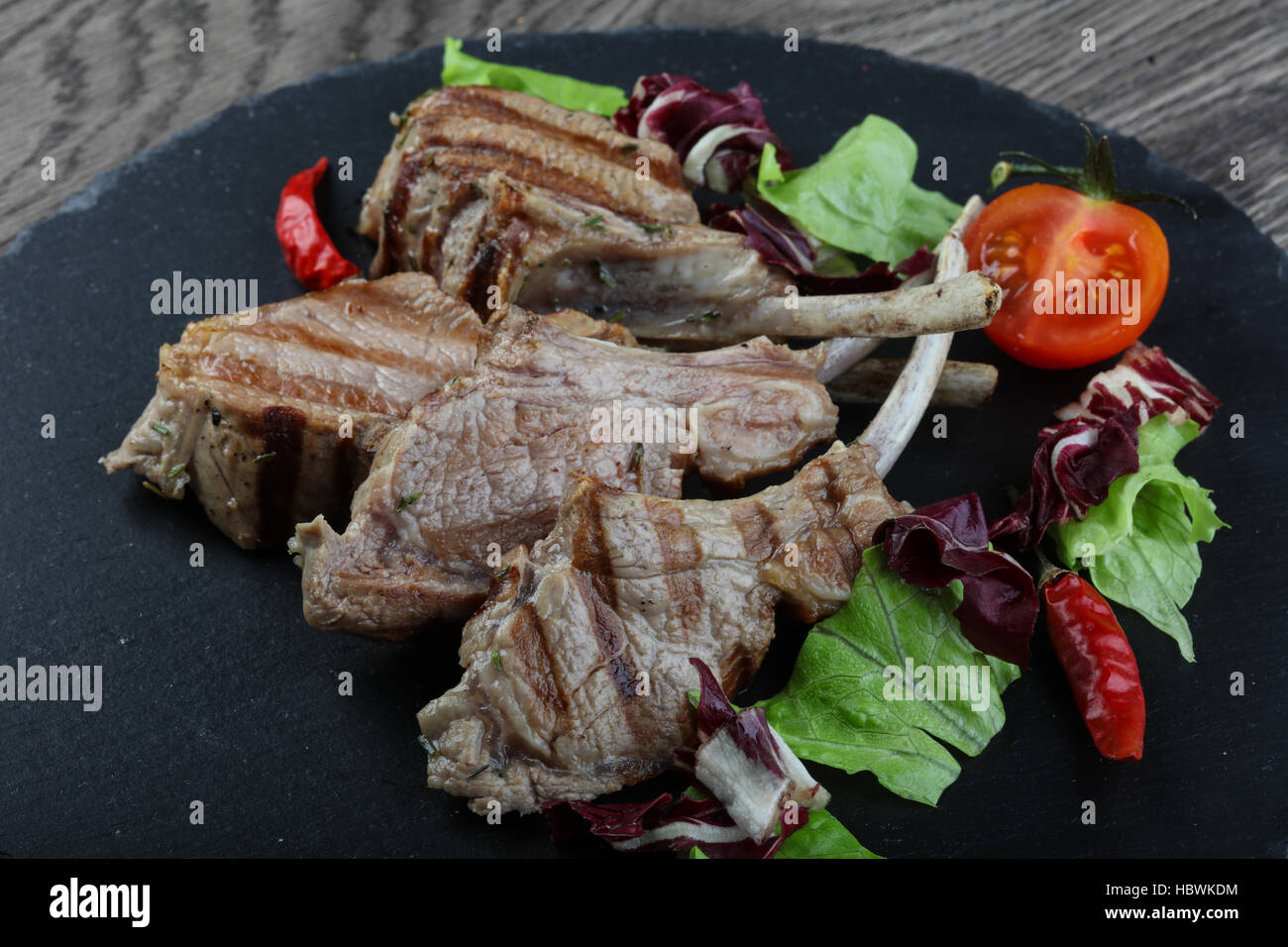 Lamb Frenched Rack grilled rib bone Stock Photo - Alamy