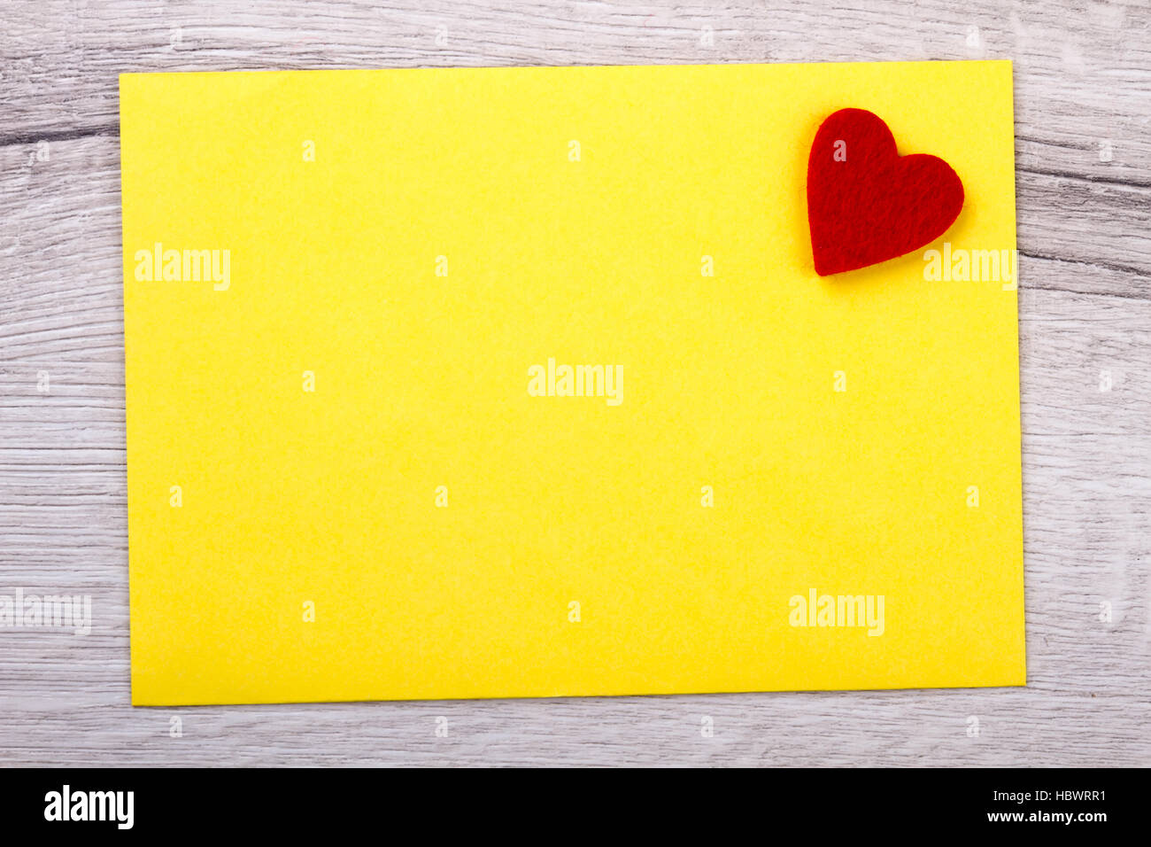 Yellow paper and heart Stock Photo - Alamy