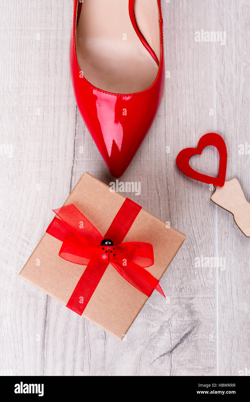Gift box and red shoe Stock Photo - Alamy