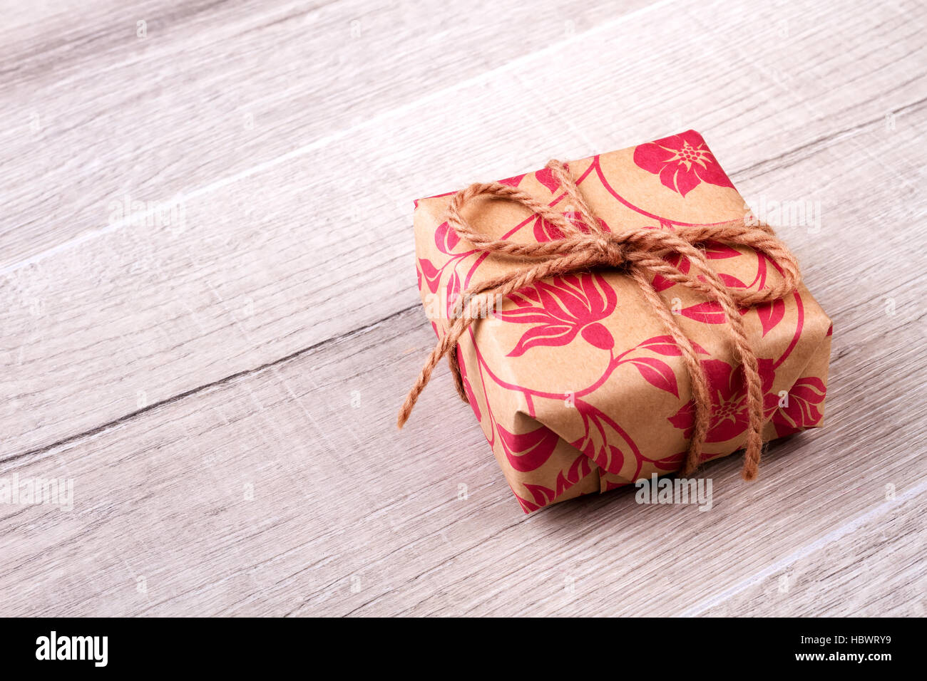 Box in wrap with rope Stock Photo - Alamy