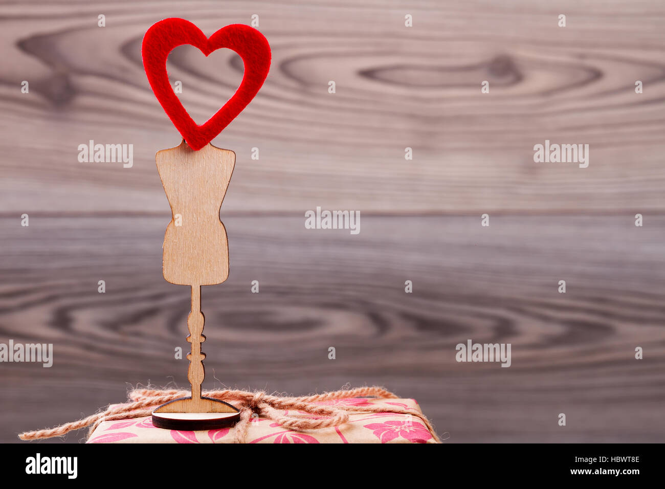 Red heart on wooden stand Stock Photo - Alamy