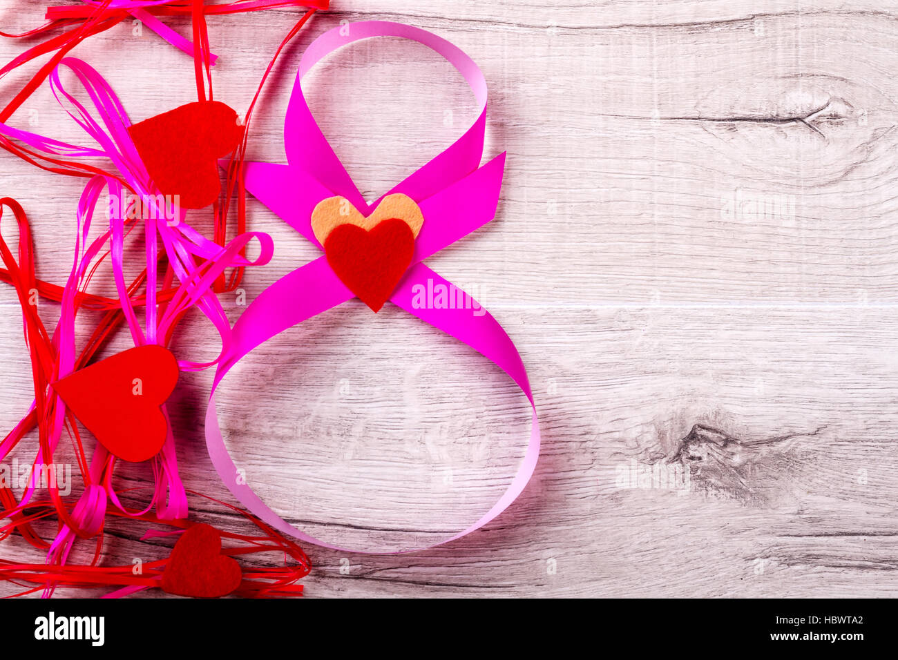 Tangled ribbon and hearts Stock Photo - Alamy