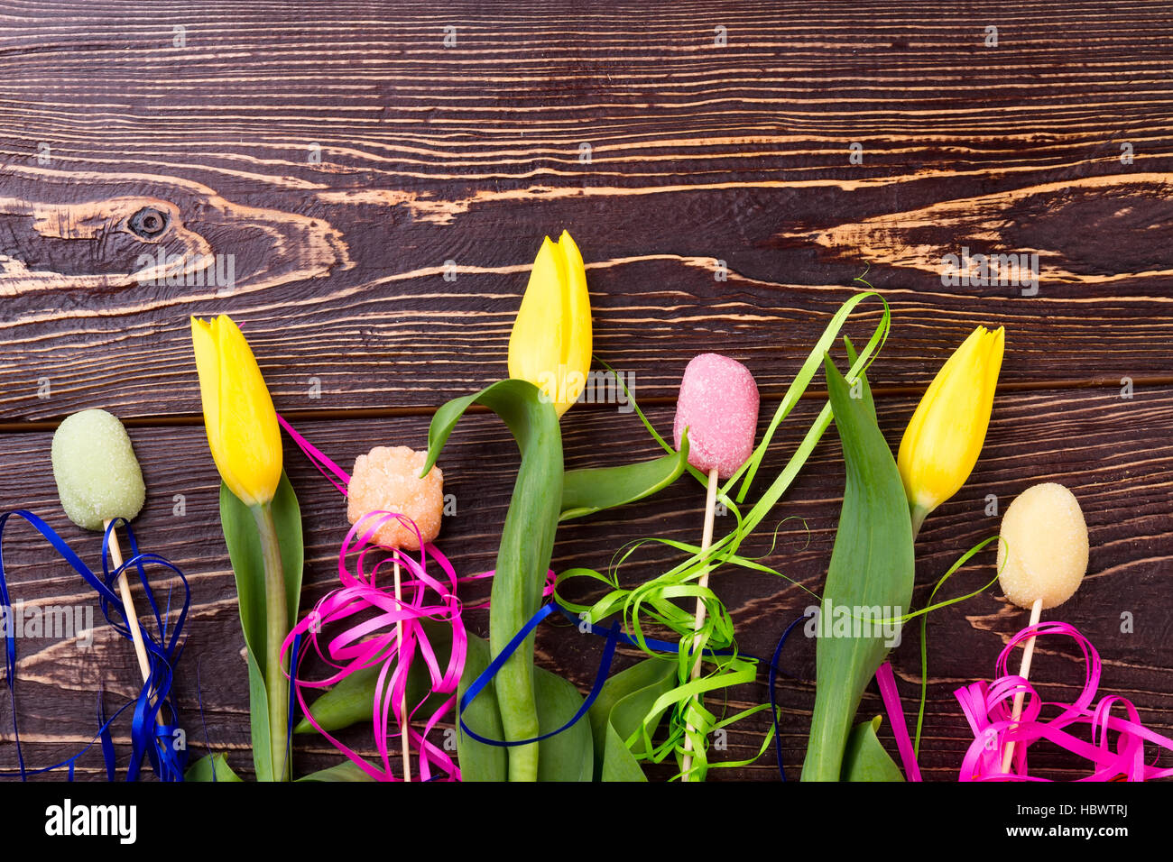 Yellow tulips and candies Stock Photo - Alamy