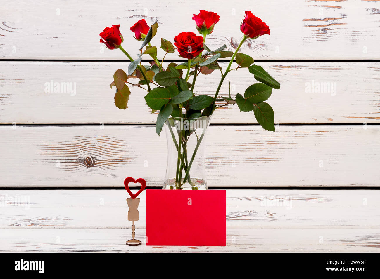 Heart on stand and roses Stock Photo - Alamy