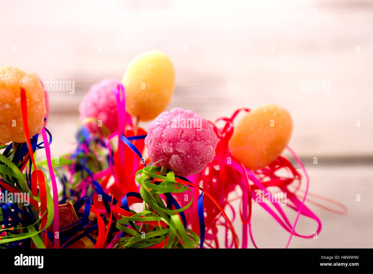 Colorful candies and streamer Stock Photo - Alamy