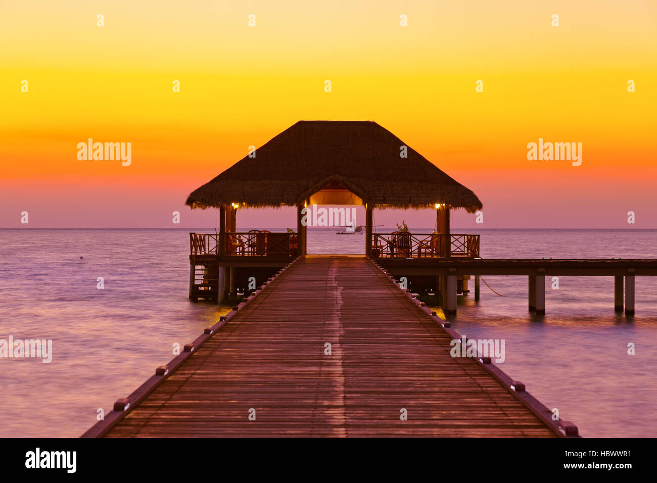 Water cafe at sunset - Maldives Stock Photo - Alamy