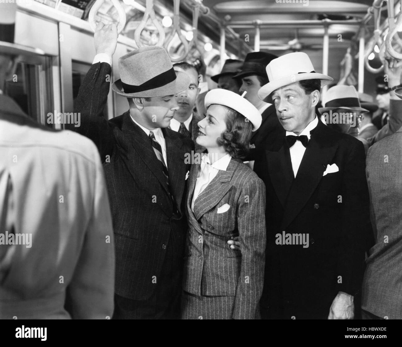 HARD TO GET, from left, Dick Powell, Olivia de Havilland, Arthur ...