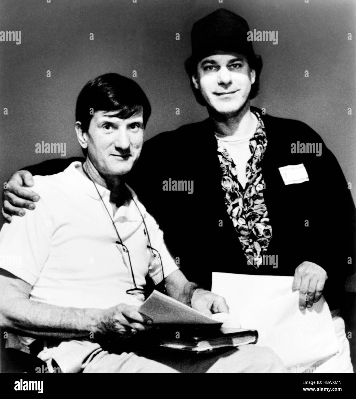 THE HARD WAY, from left: director John Badham, producer Rob Cohen on ...