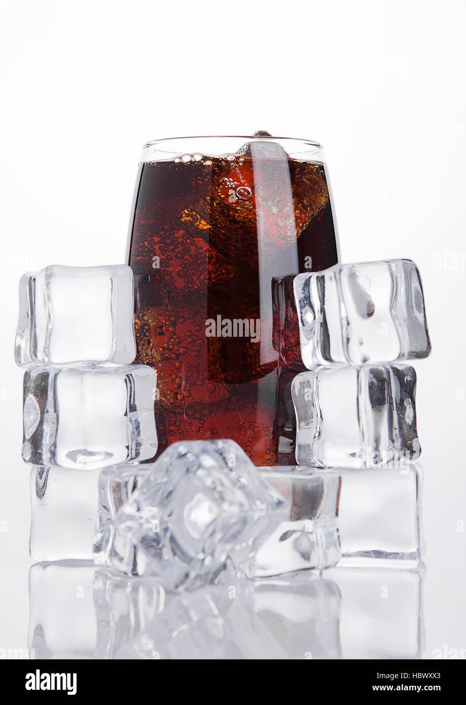 Glass of cold cola soda drink with ice cubes on white background Stock ...