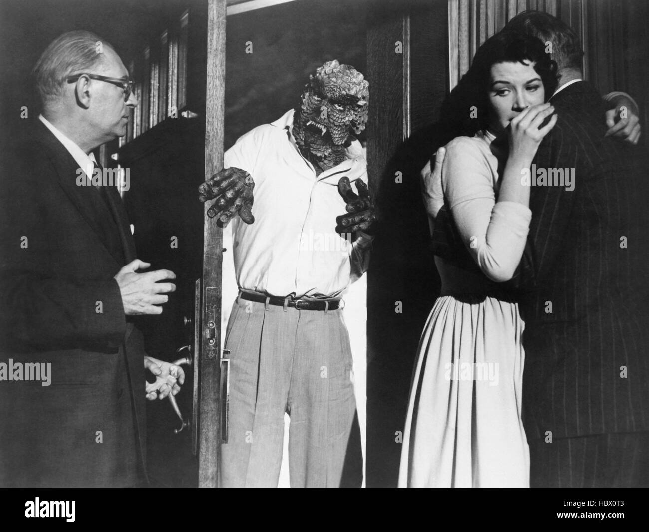 THE HIDEOUS SUN DEMON, Robert Clarke (in doorway), Patricia Manning ...