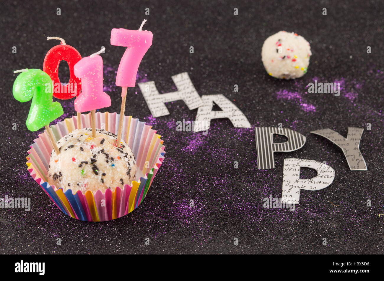 Happy new 2017 small cake with candles Stock Photo - Alamy