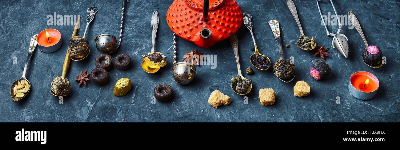 banner of set tea leaves in stylish tea spoon on slate concrete ...