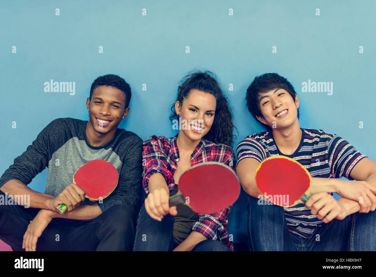 Diverse friends playing tennis hi-res stock photography and images - Alamy