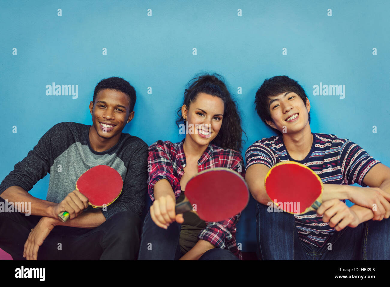Diverse friends playing tennis hi-res stock photography and images - Alamy