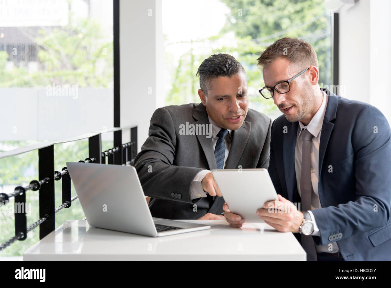 Two Businessmen Cafe Meeting Wireless Tablet Concept Stock Photo - Alamy