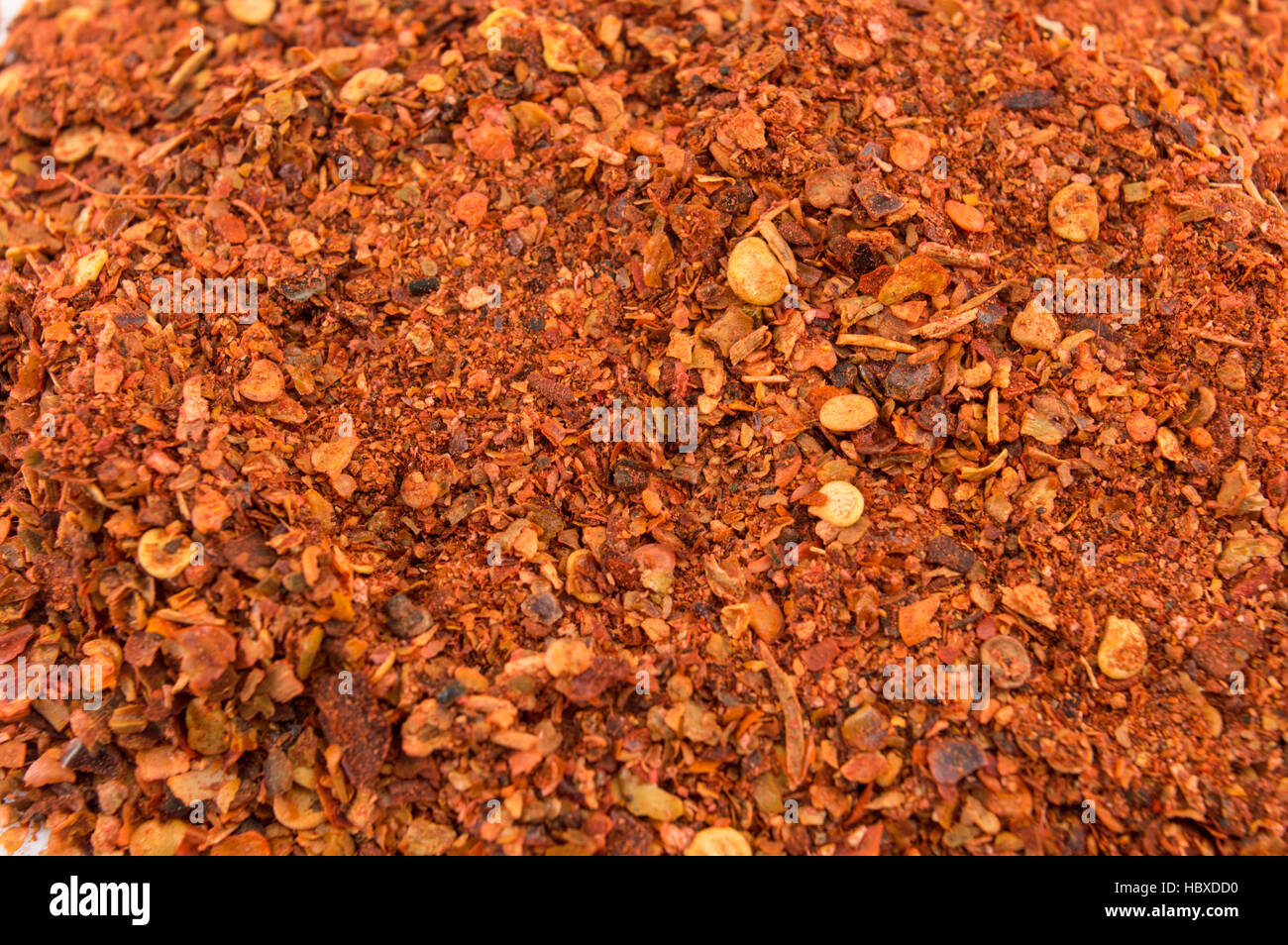 Ground red pepper and dried peppers closeup Stock Photo - Alamy