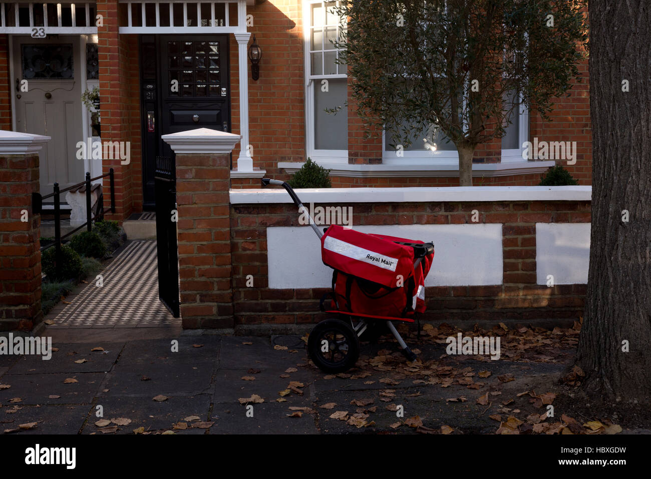 Autumn leaves Royal Mail postman delivery cart, Barnes West London ...