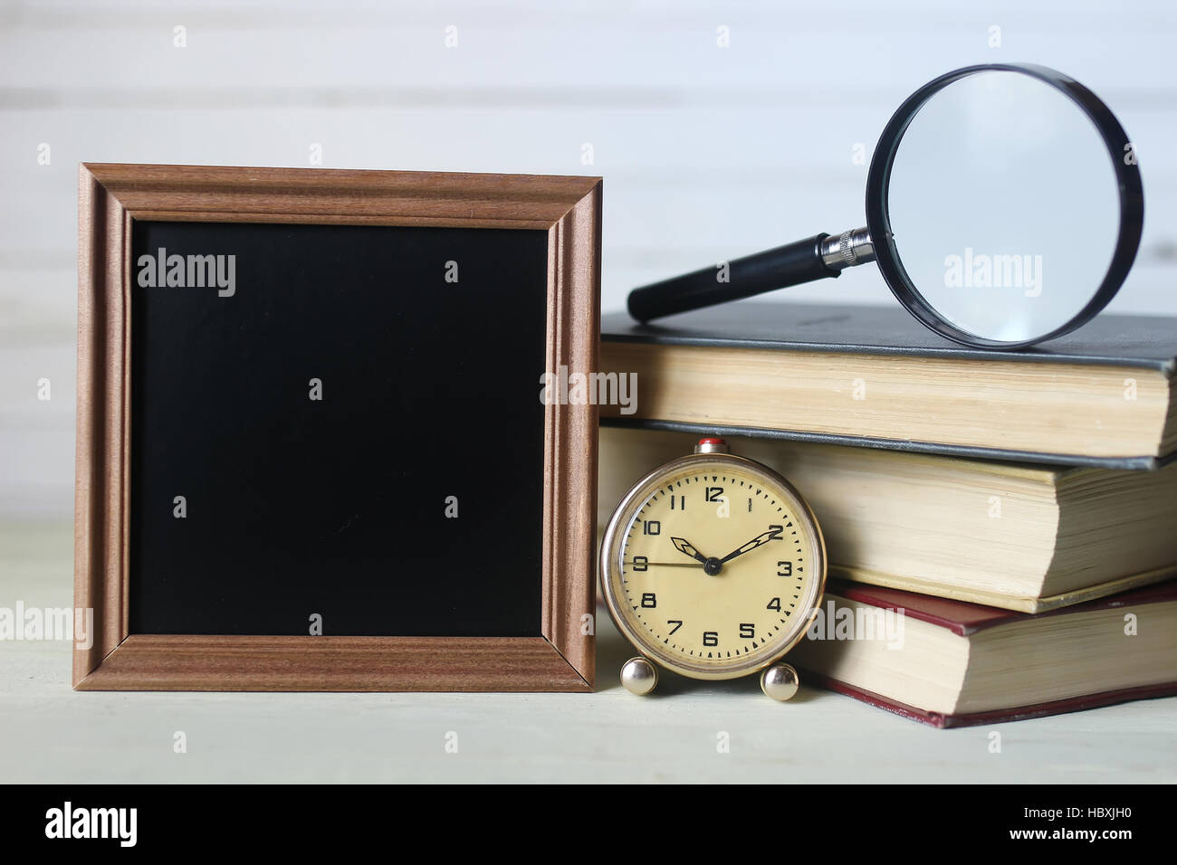 frame for text books and watch Stock Photo - Alamy