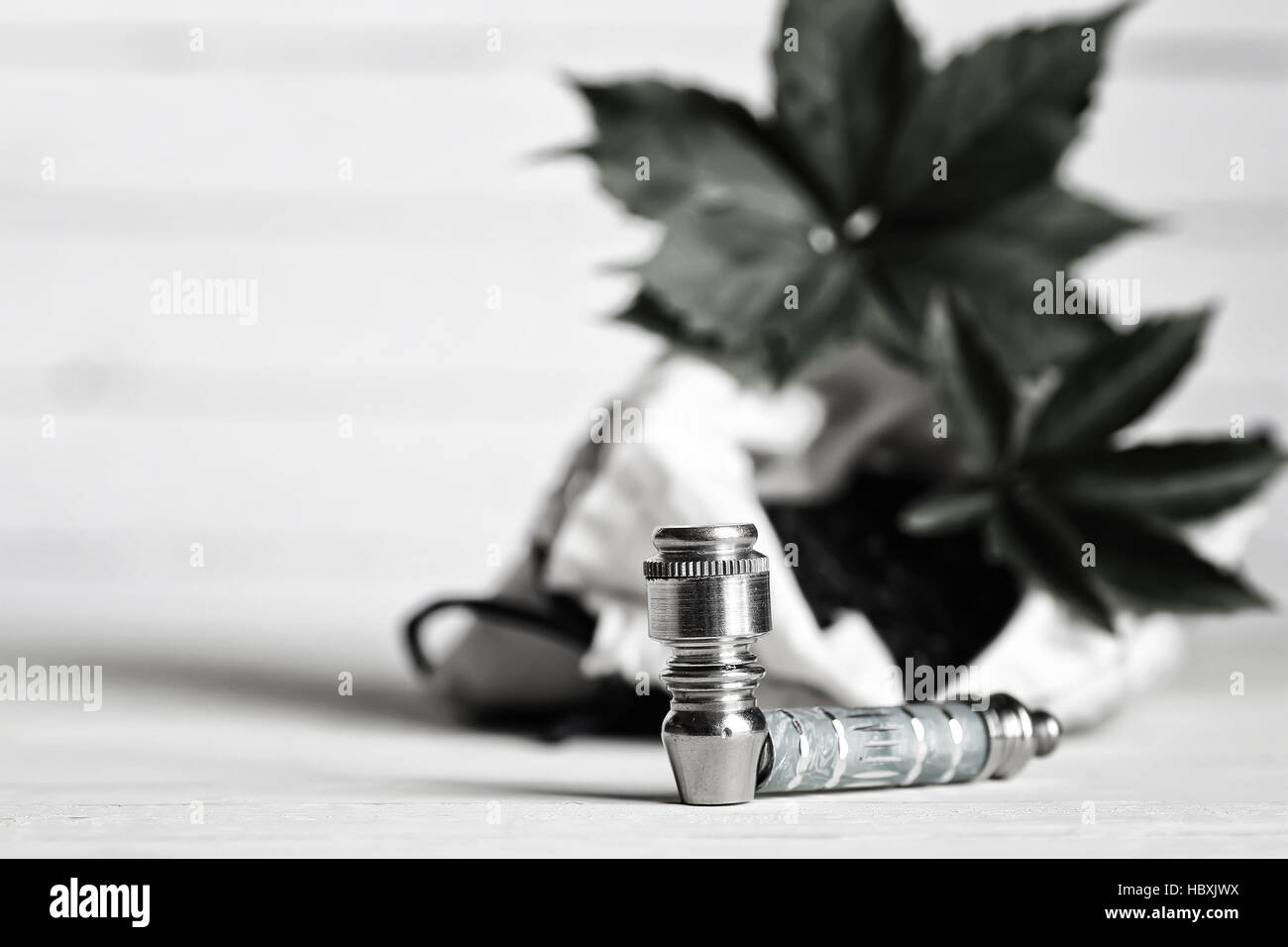 marijuana pipe on wooden background Stock Photo - Alamy