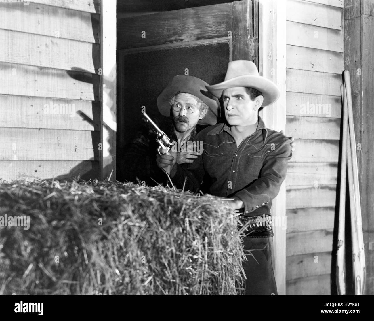 THE GUN RANGER, from left: Ernie Adams, Bob Steele, 1936 Stock Photo ...