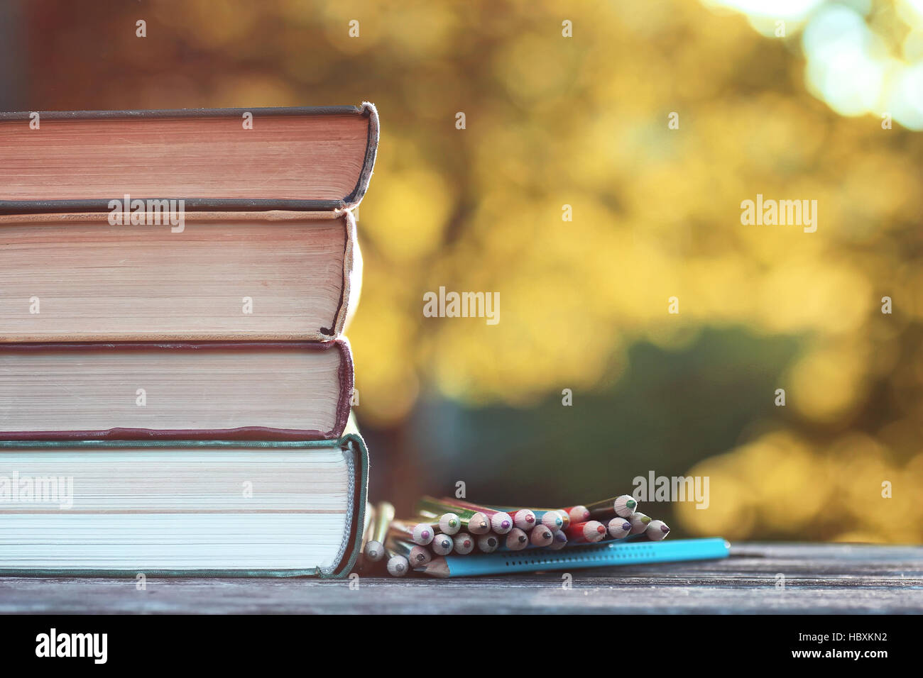 autumn book stack wooden outdoor Stock Photo - Alamy