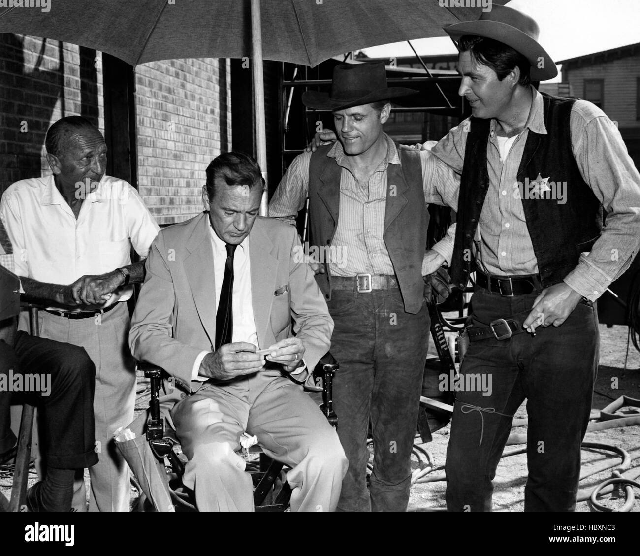 THE HANGMAN, Director Michael Curtiz watches as Gary Cooper rolls his ...