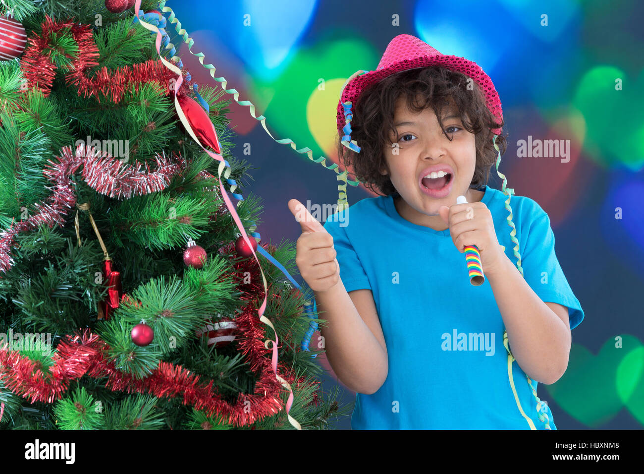 Child blowing horn hi-res stock photography and images - Alamy