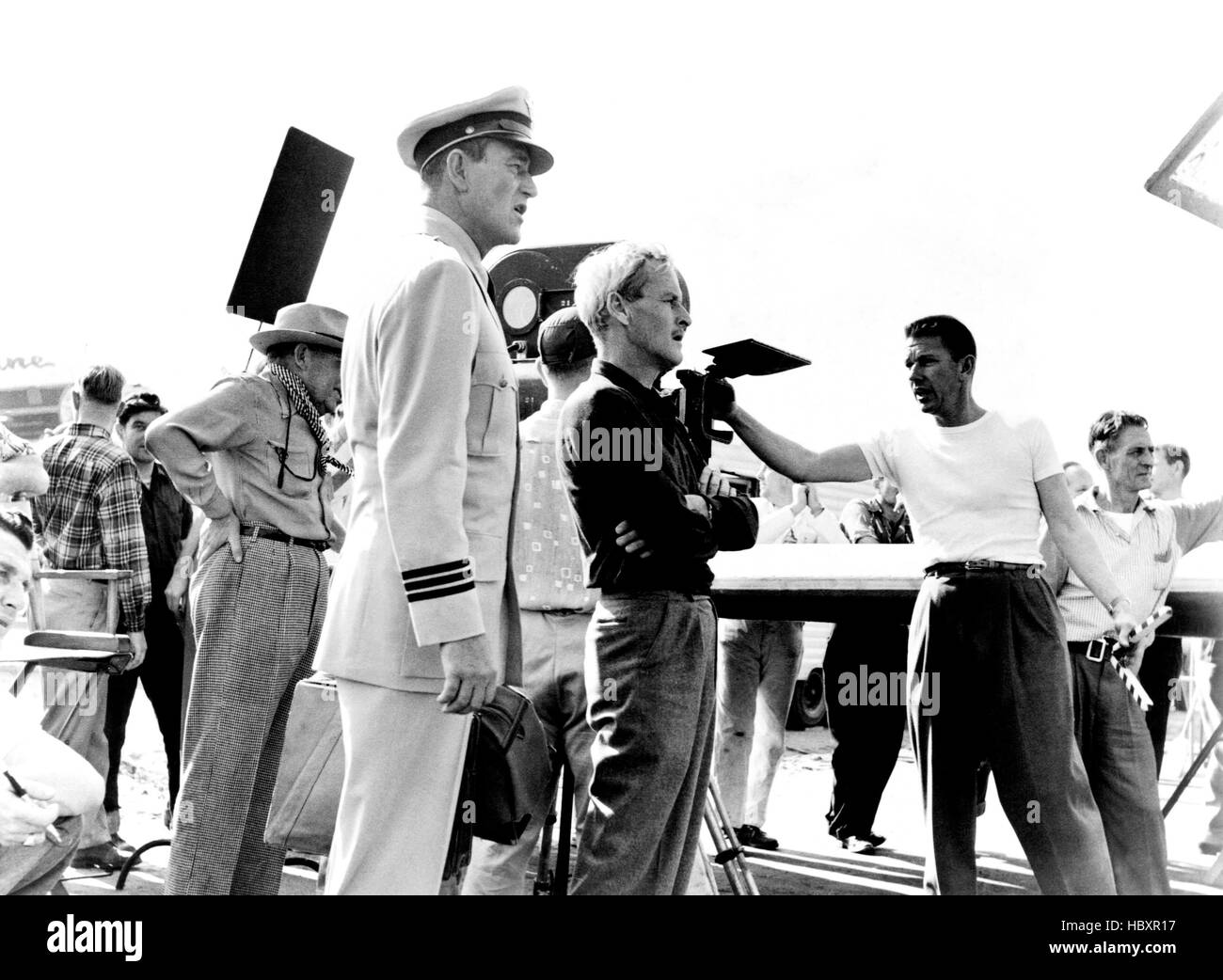THE HIGH AND THE MIGHTY, from left, front, John Wayne, director William ...