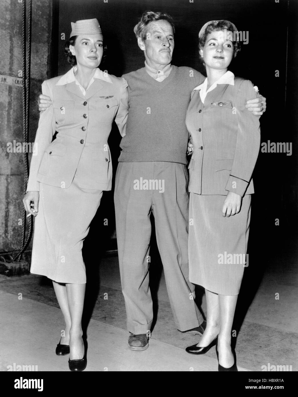 THE HIGH AND THE MIGHTY, from left, Doe Avedon, director William Wellman, Dionne Wheeler, on-set ...