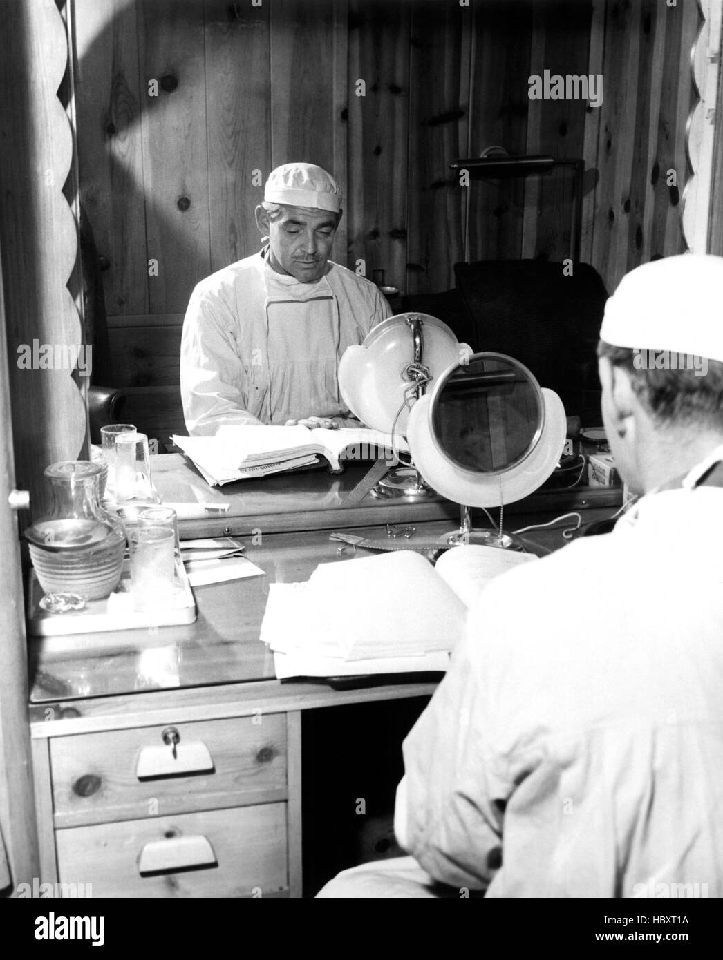HOMECOMING, Clark Gable reading the script in his dressing roon, 1948 ...