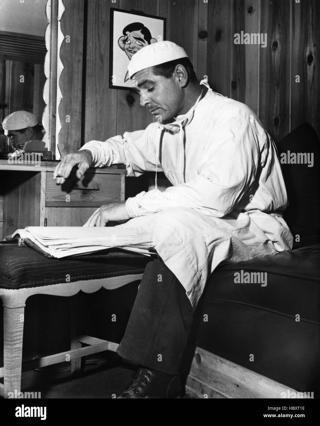 HOMECOMING, Clark Gable, reading the script in his dressing room, 1948 ...