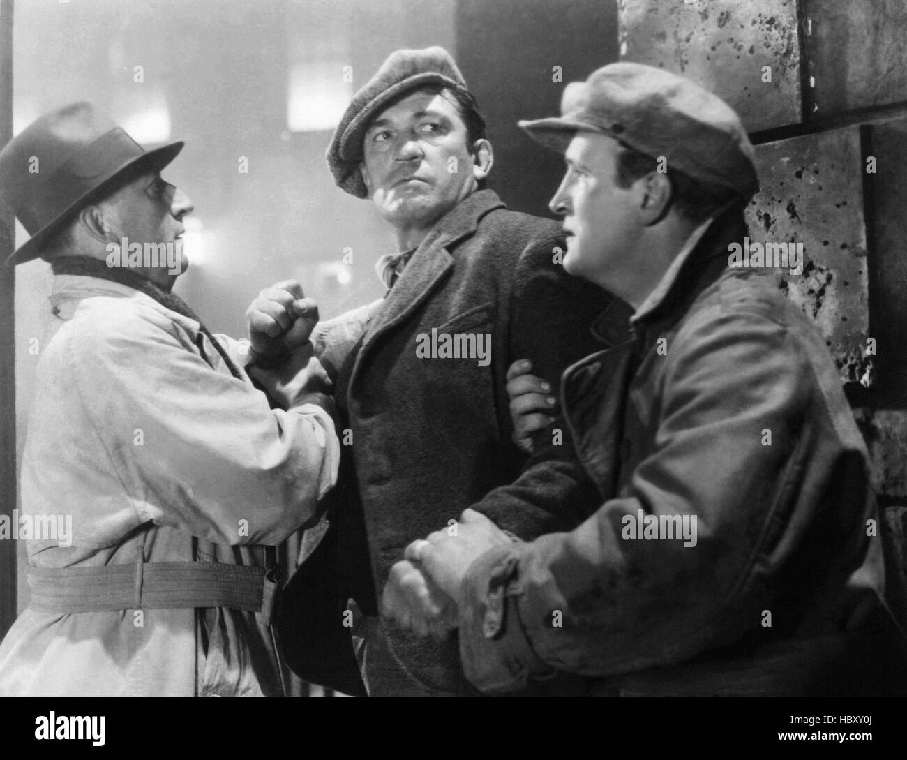 THE INFORMER, from left: Neil Fitzgerald, Victor McLaglen, Joe Sawyer ...