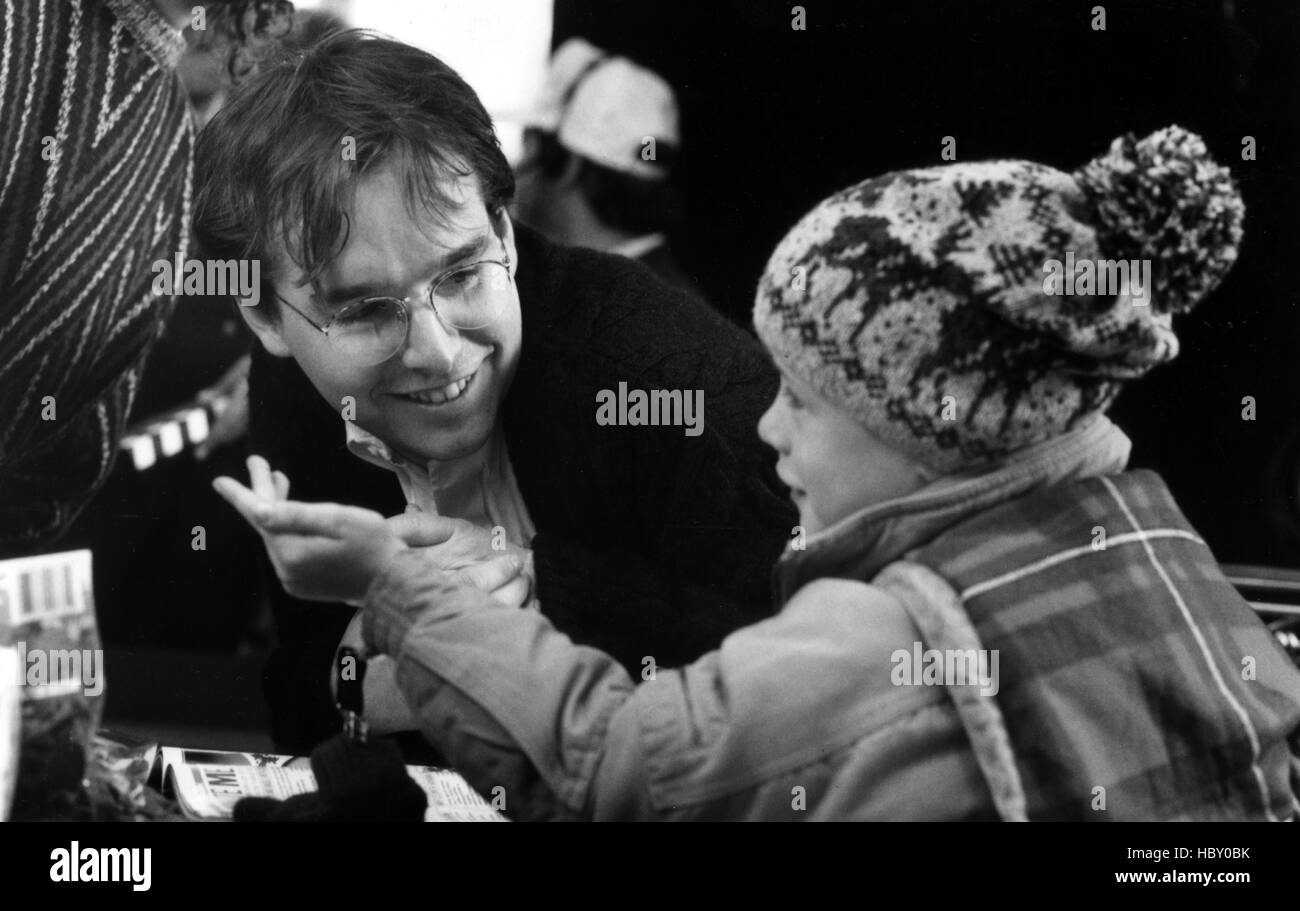 HOME ALONE, Director Chris Columbus and Macaulay Culkin in between ...