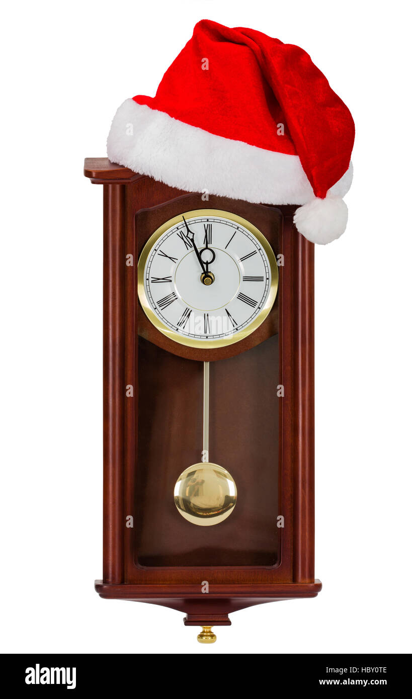 Wall clock and cap of Santa Claus, isolated on white background Stock ...