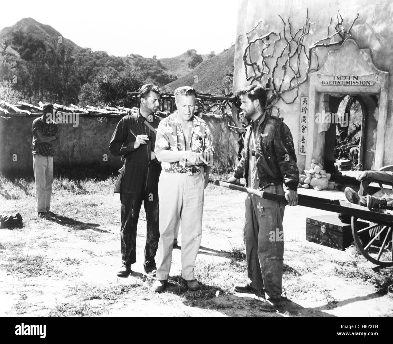 THE HUNTERS, from left: Robert Mitchum, director Dick Powell, Robert ...