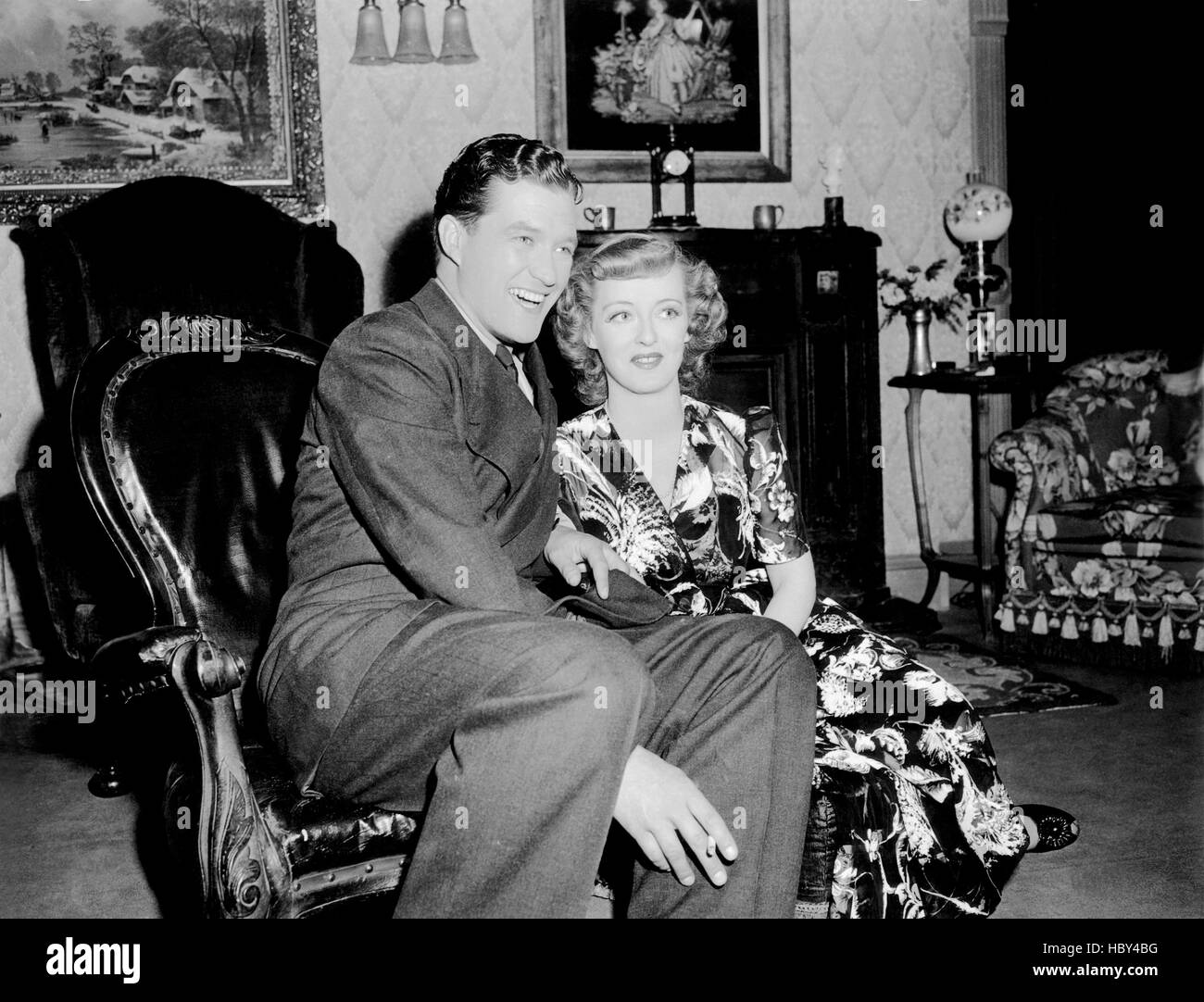 IN THIS OUR LIFE, from left, Dennis Morgan, Bette Davis, on-set, 1942 ...