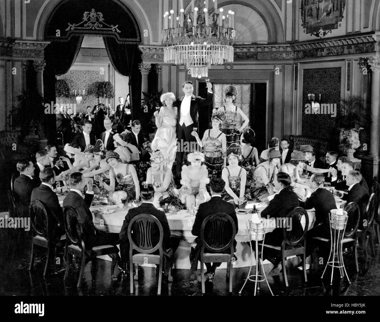 IT PAYS TO ADVERTISE, Bryant Washburn, (raising glass, atop table ...