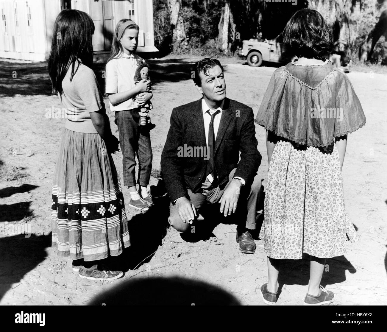 JOHNNY TIGER, from left, Carol Seflinger, (holding doll), Robert Taylor ...