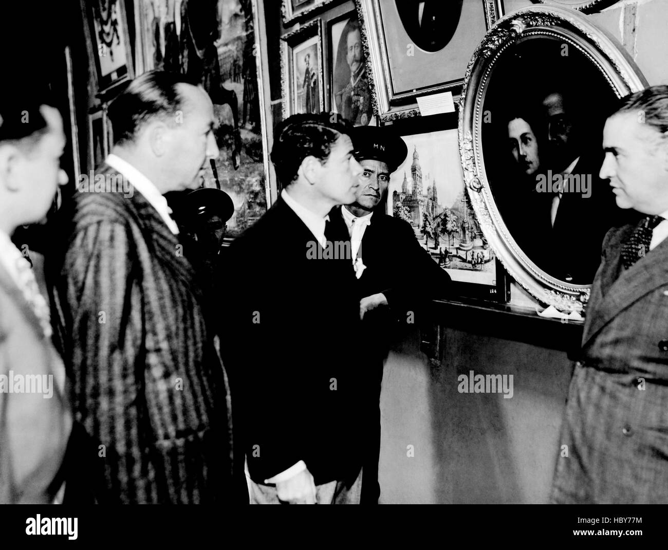 JUAREZ, from left, producer Hal Wallis, Paul Muni, touring a museum in ...