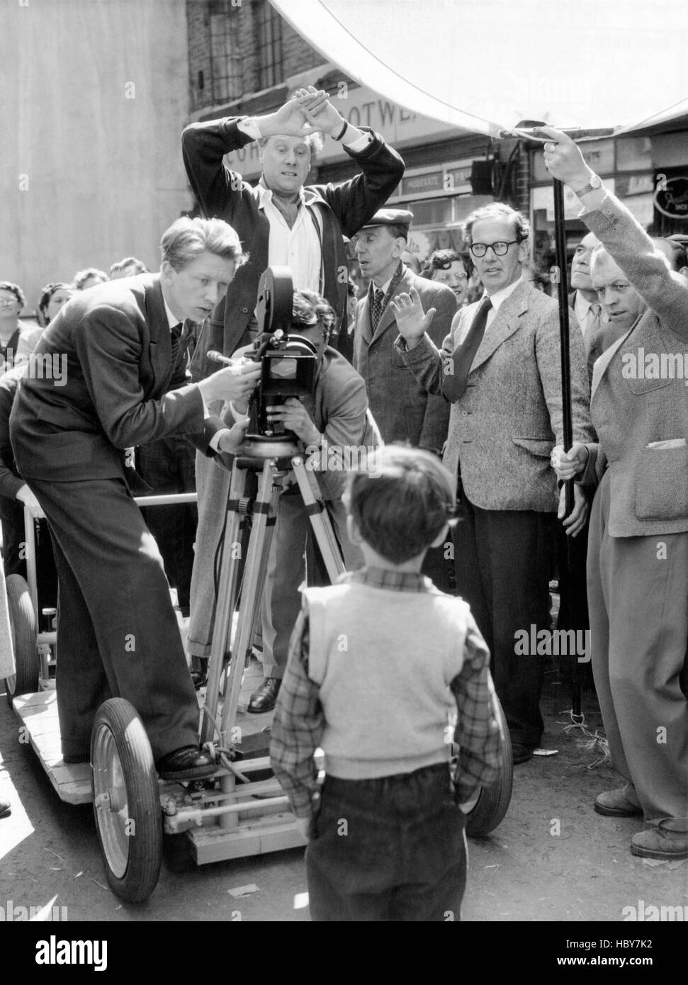 A KID FOR TWO FARTHINGS, director Carol Reed (hands crossed ...