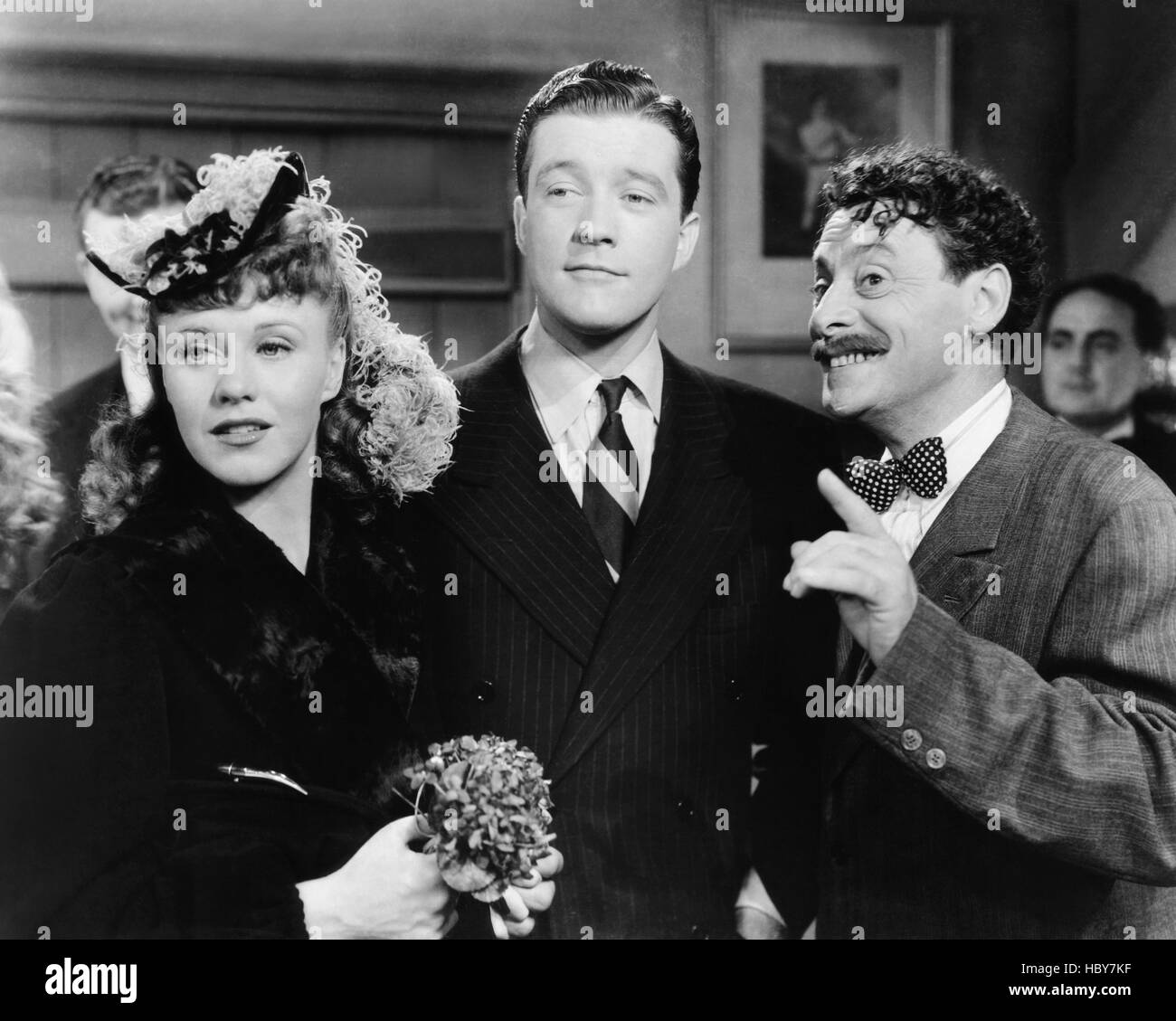KITTY FOYLE, from left, Ginger Rogers, Dennis Morgan, Eduardo Ciannelli ...
