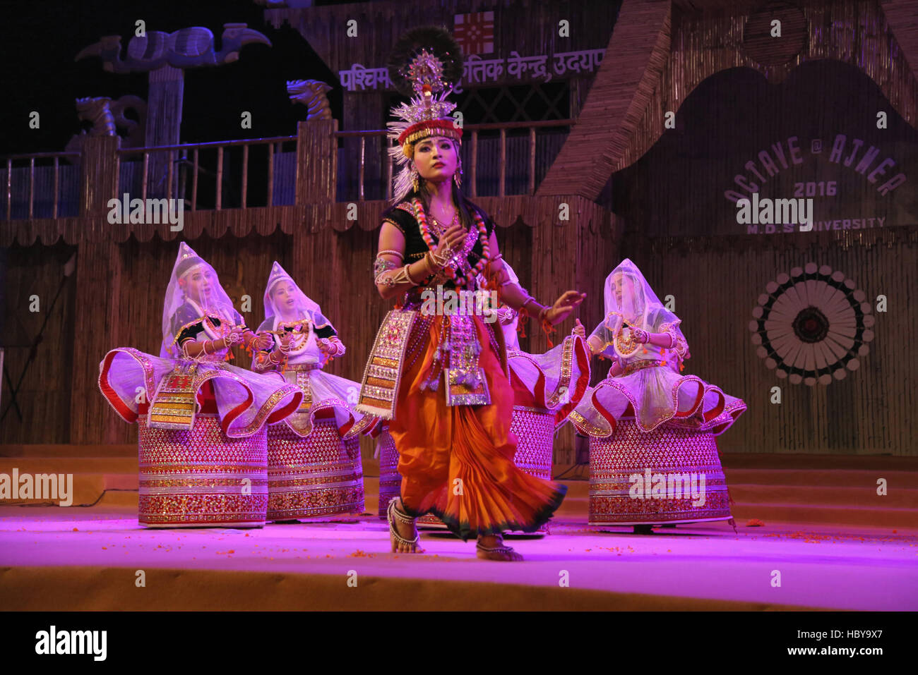 A dance group of Manipur dancers performing Manipur Rass dance on stage ...